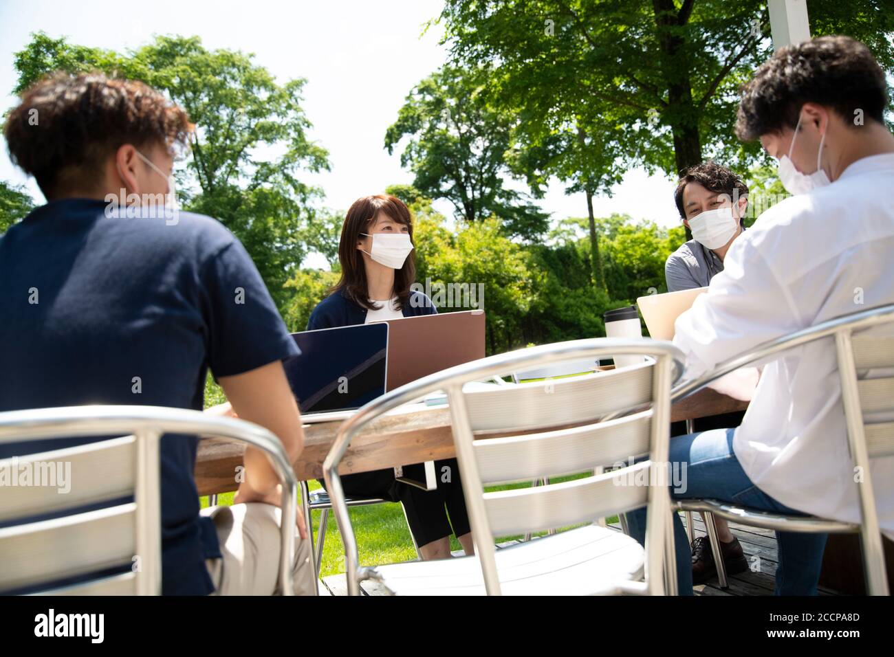 Men and Woman Having a Meeting with Face Mask on an Outdoor Office that ...