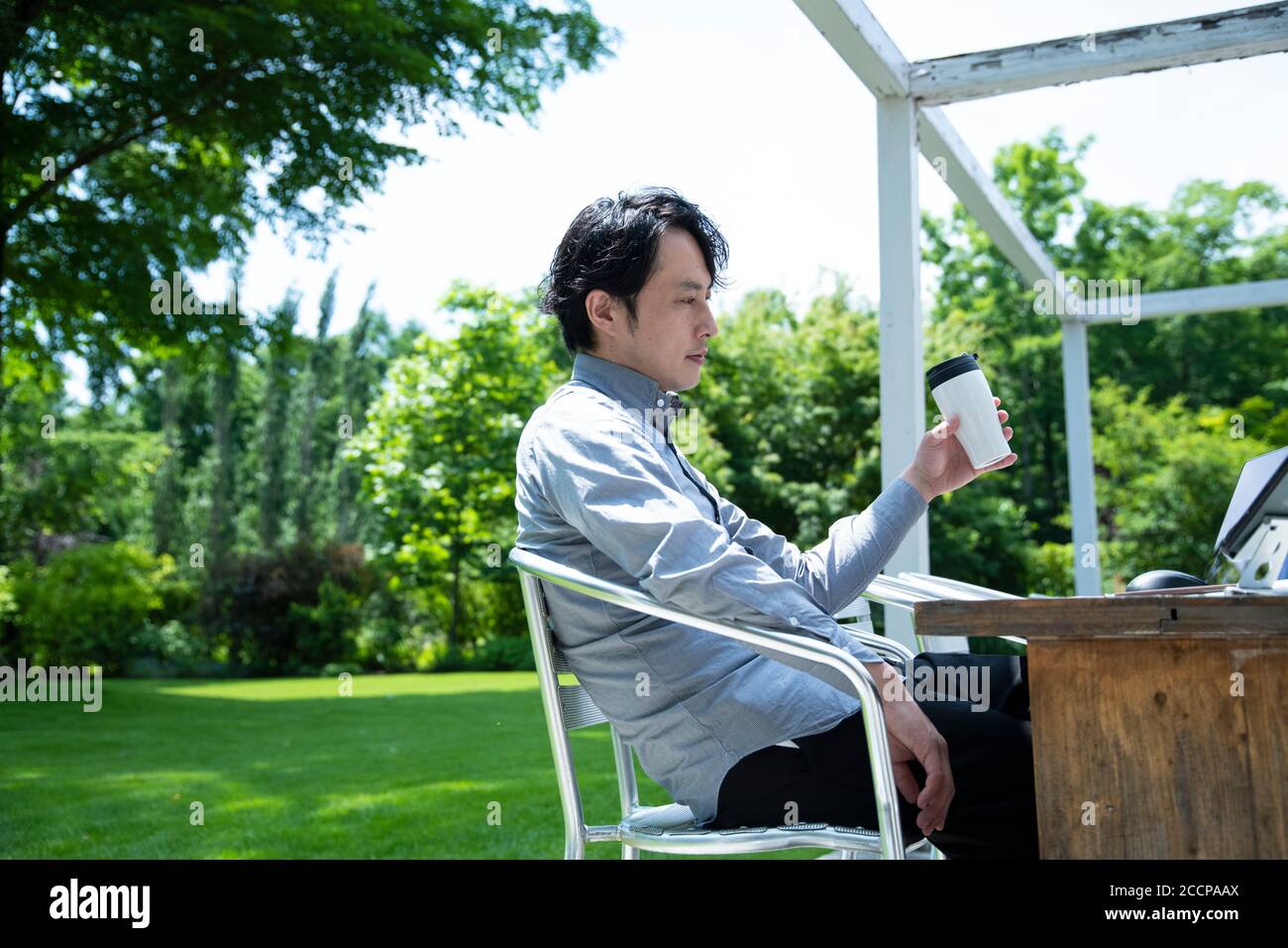 Mature Man are Working on an Outdoor Office that Set Social Distancing ...