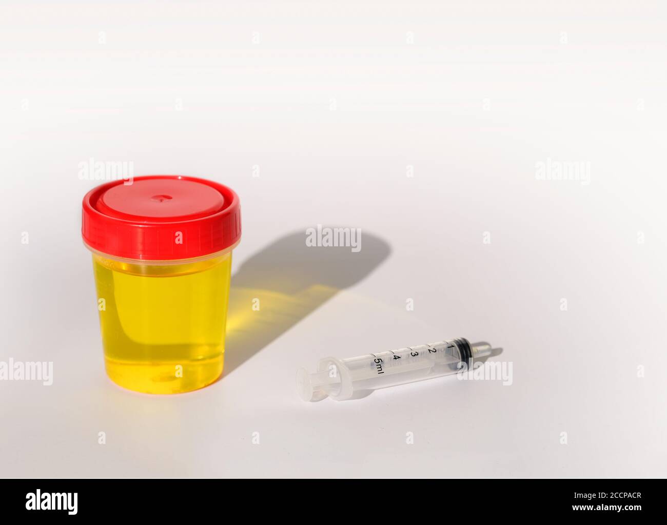 Urine test and syringe on white background. Urinalysis, Drug Testing ...