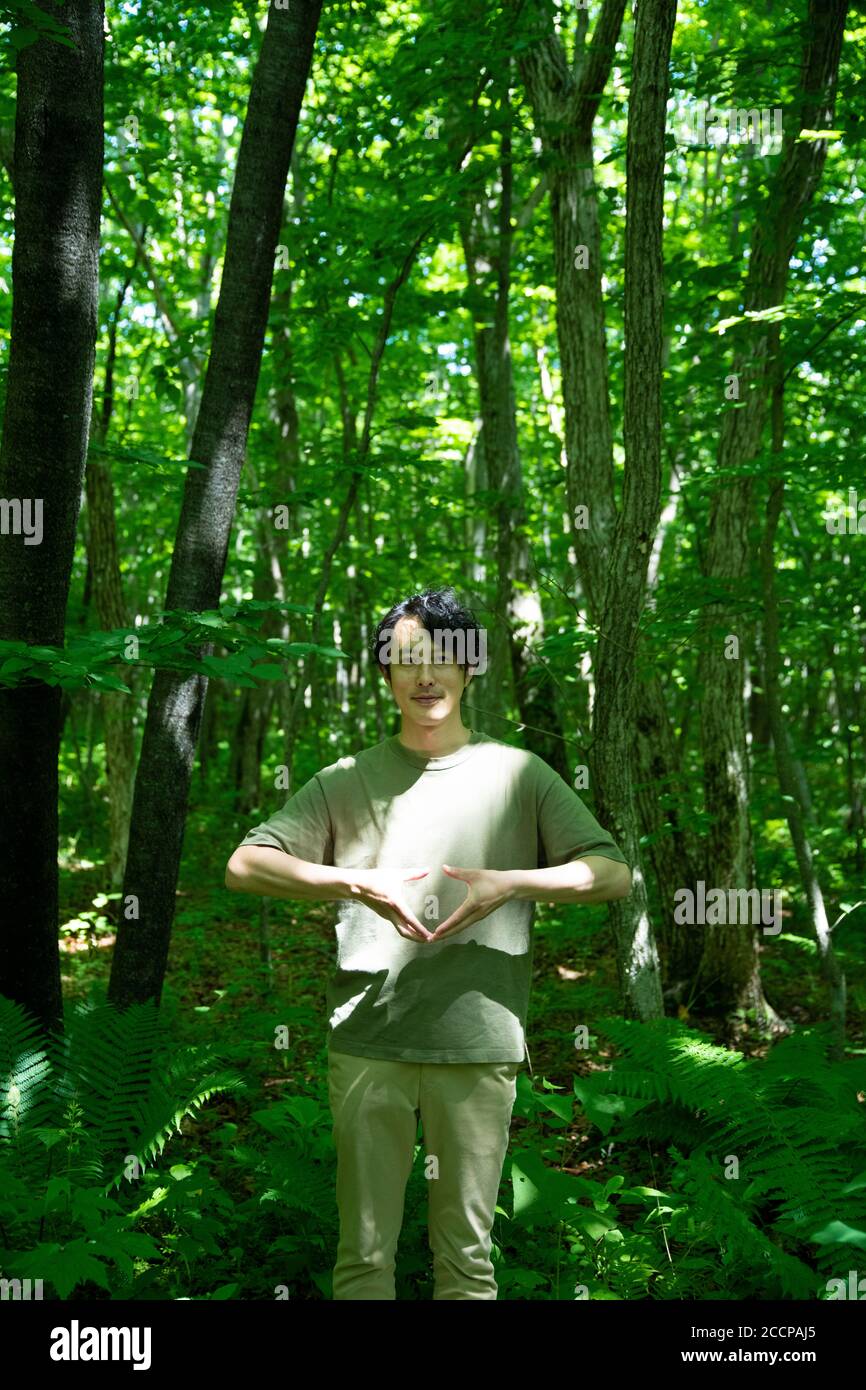 Mature Man Says Earth in Sign Language Stock Photo - Alamy