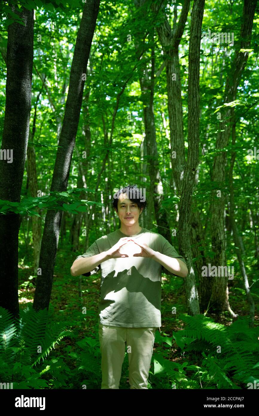 Mature Man Says Earth in Sign Language Stock Photo - Alamy