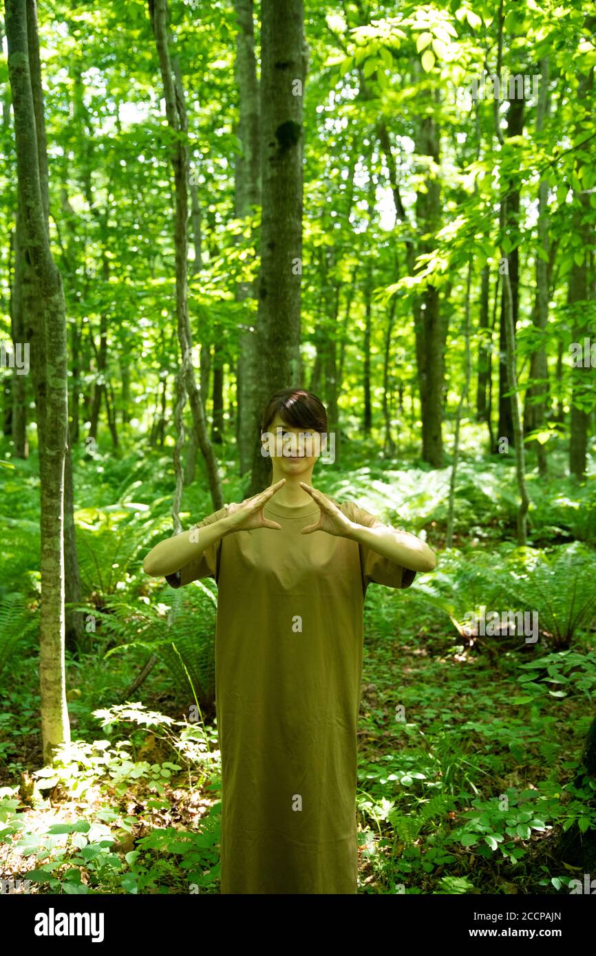 Mature Woman Expressing Earth in Sign Language Stock Photo - Alamy