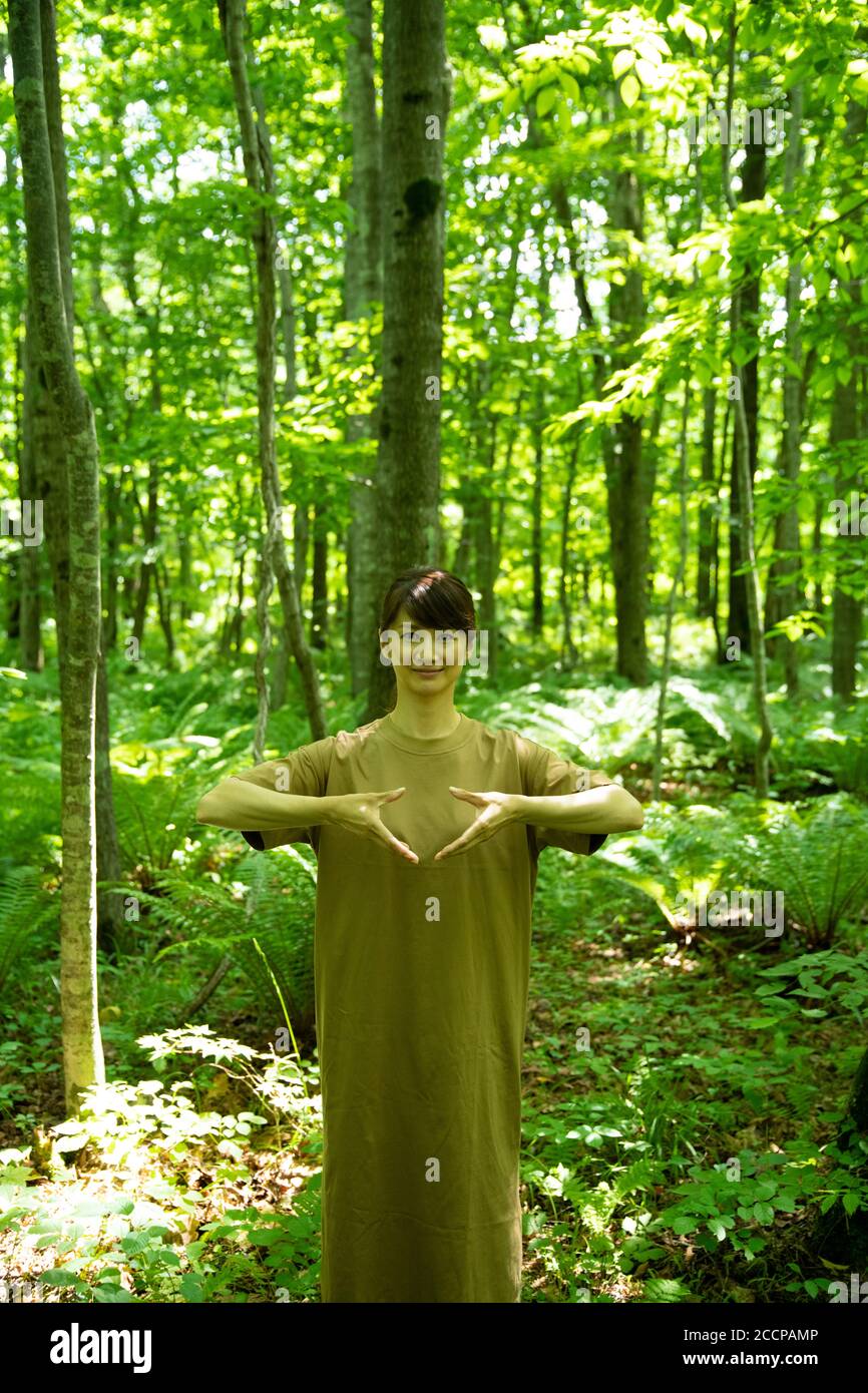 Mature Woman Expressing Earth in Sign Language Stock Photo - Alamy