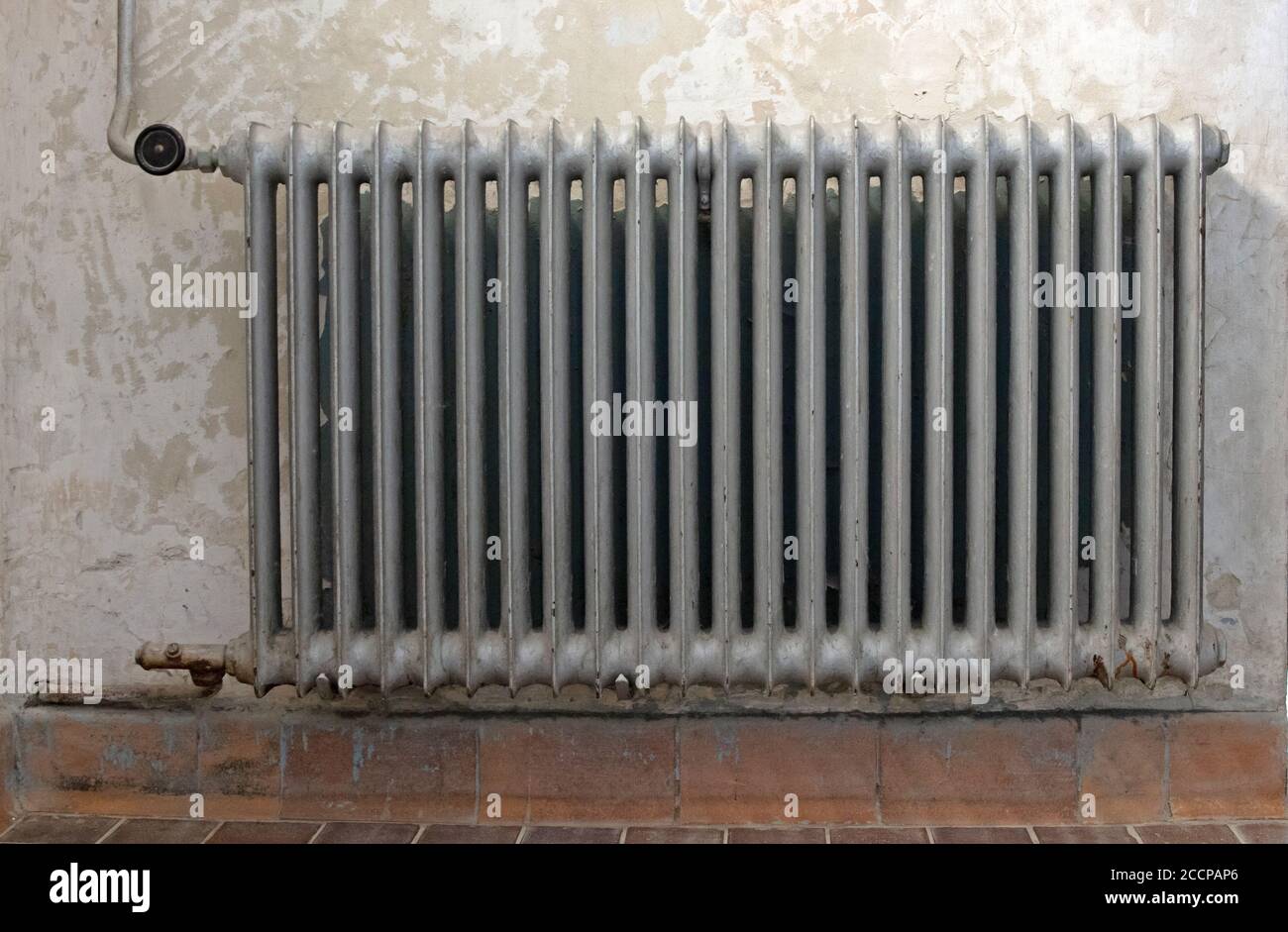 Old radiator in an empty historic home, heater Stock Photo - Alamy