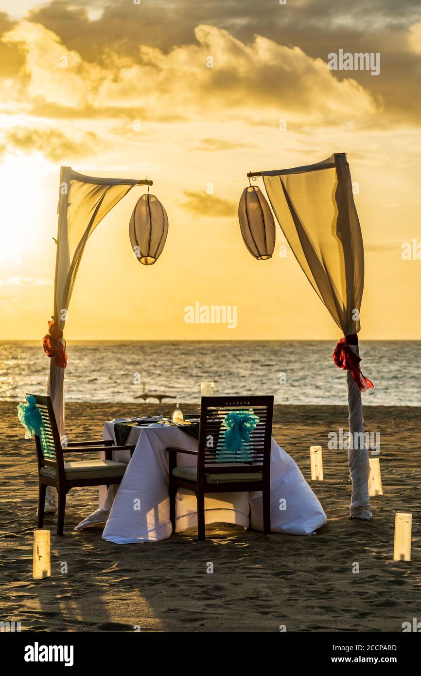 Dinner table set at the beach in Bali Indonesia Stock Photo - Alamy