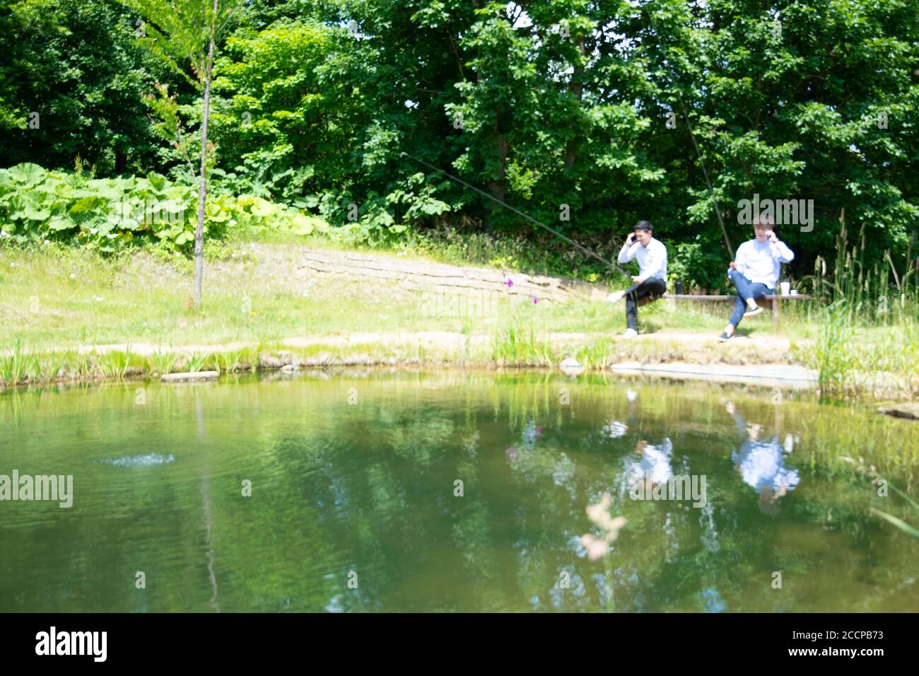 Young men fishing hi-res stock photography and images - Alamy