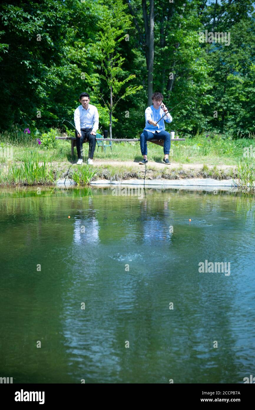 Young japanese man fishing hi-res stock photography and images - Alamy
