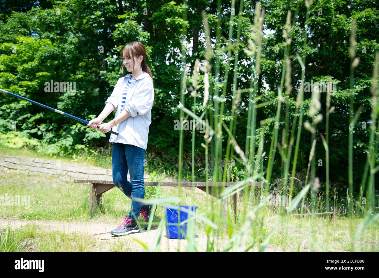 Japanese woman fishing hi-res stock photography and images - Alamy