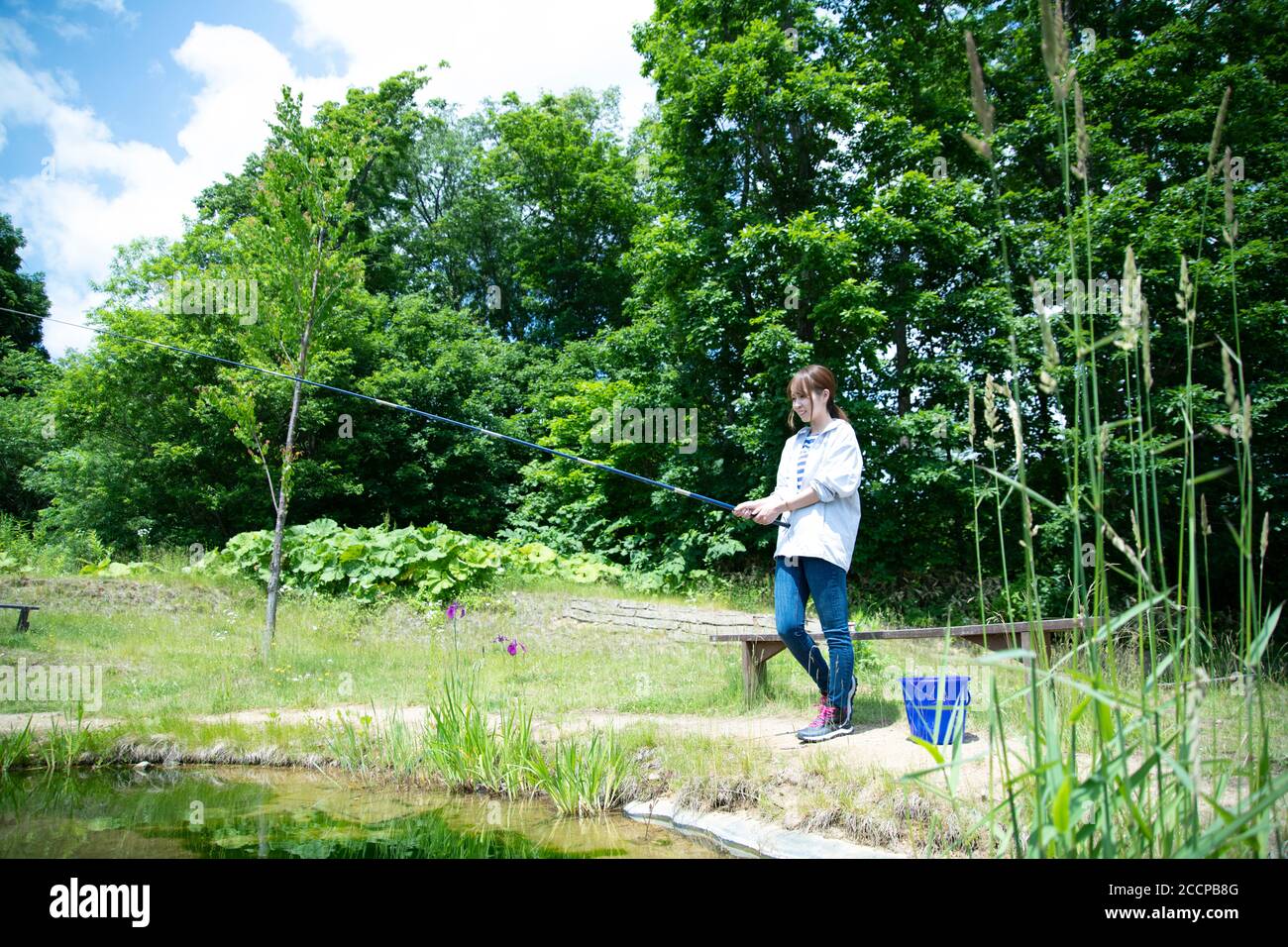 Japanese woman fishing hi-res stock photography and images - Alamy