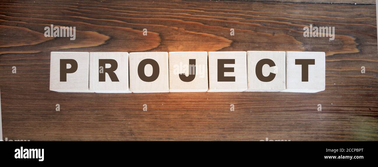 Project word letters on wooden blocks on table. Business Risk ...