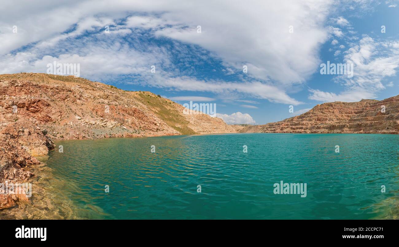 Emerald lake in a flooded quarry. Emerald green lake in flooded ...