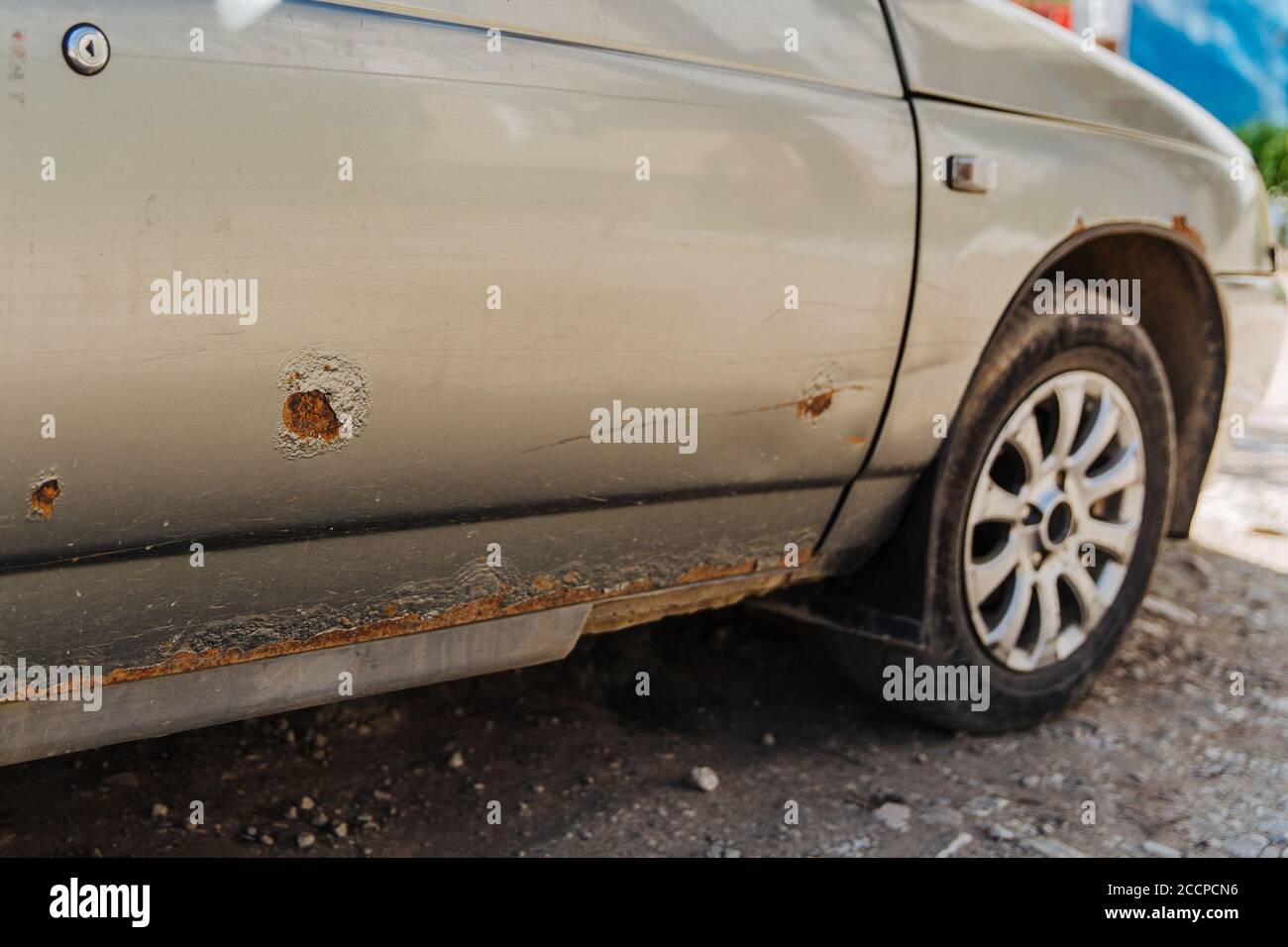 Car door with rust and metal corrosion. Rust stains. Need repairs, road ...