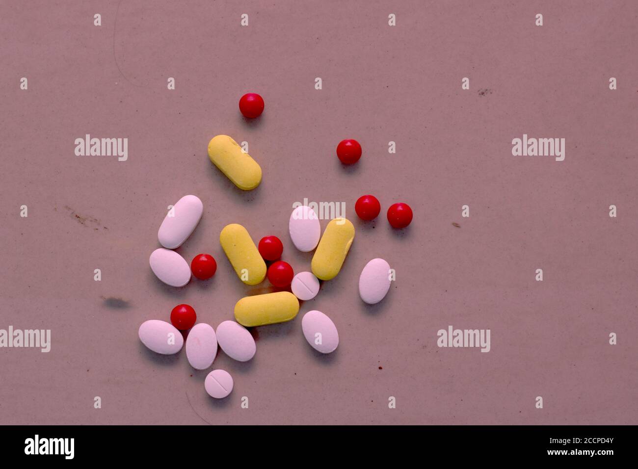 White yellow and red color medicine on the floor. Partial focus Stock ...