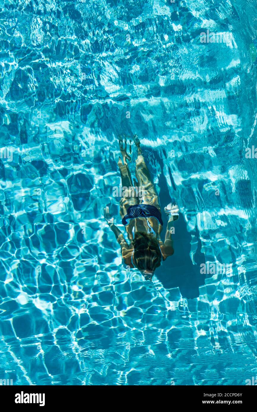 Woman Diving In Swimming Pool High Resolution Stock Photography and ...