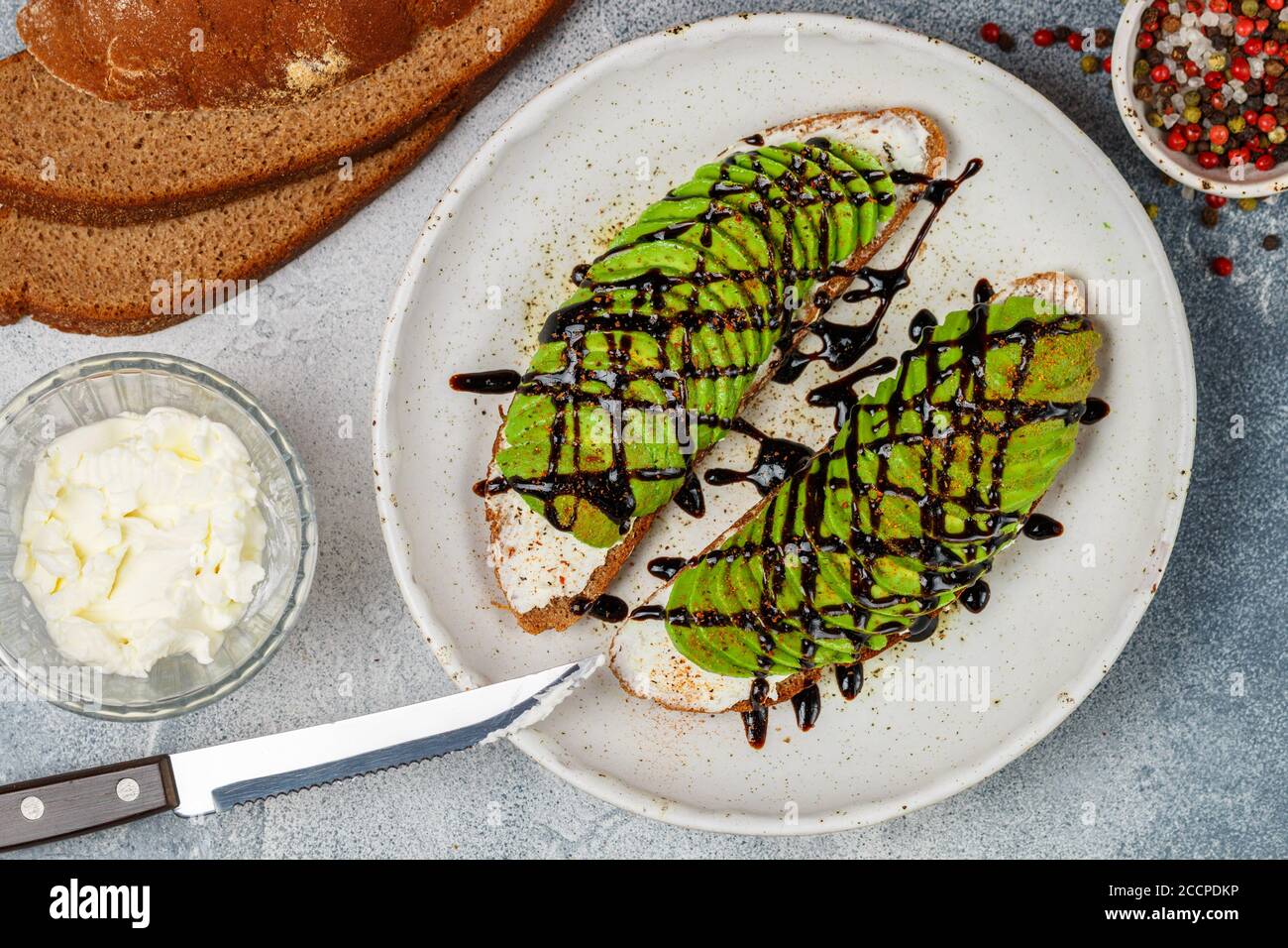 Rye bread toast with avocado, cream cheese (ricotta) and balsamic ...
