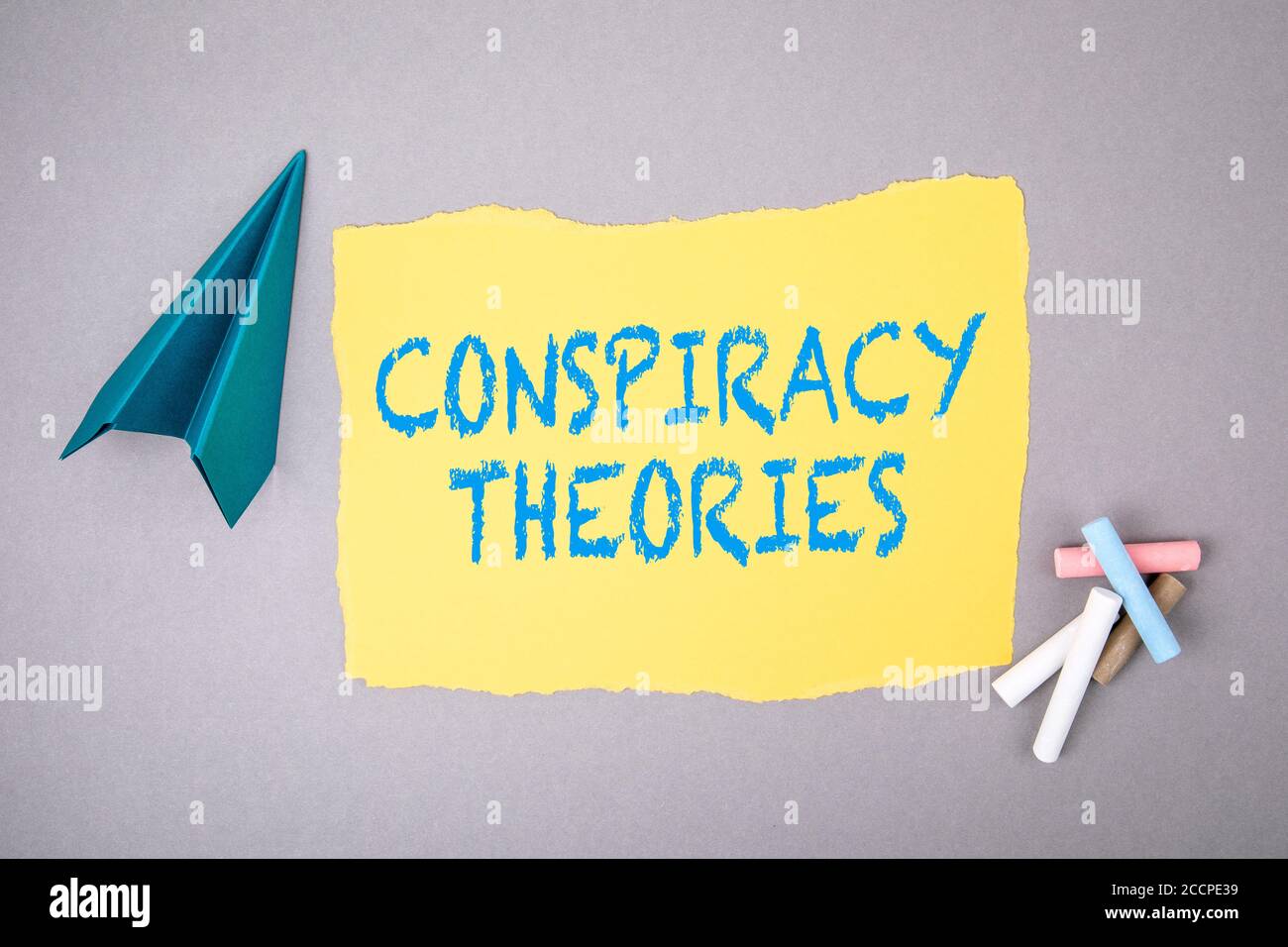 CONSPIRACY THEORIES. Text on note sheet, paper plane, symbol of gaining ...