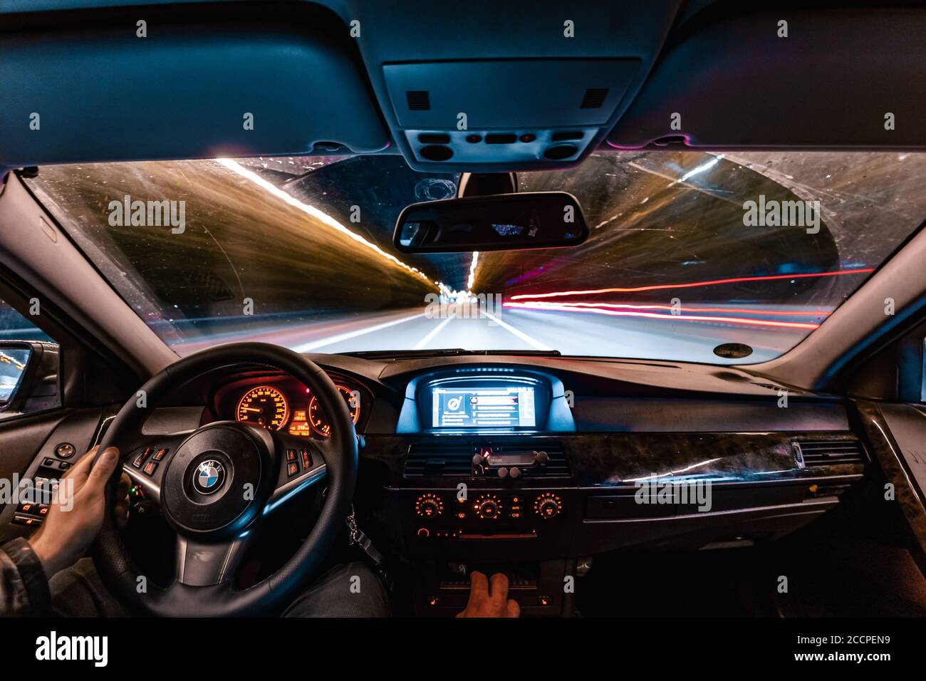 bmw night driving Stock Photo - Alamy