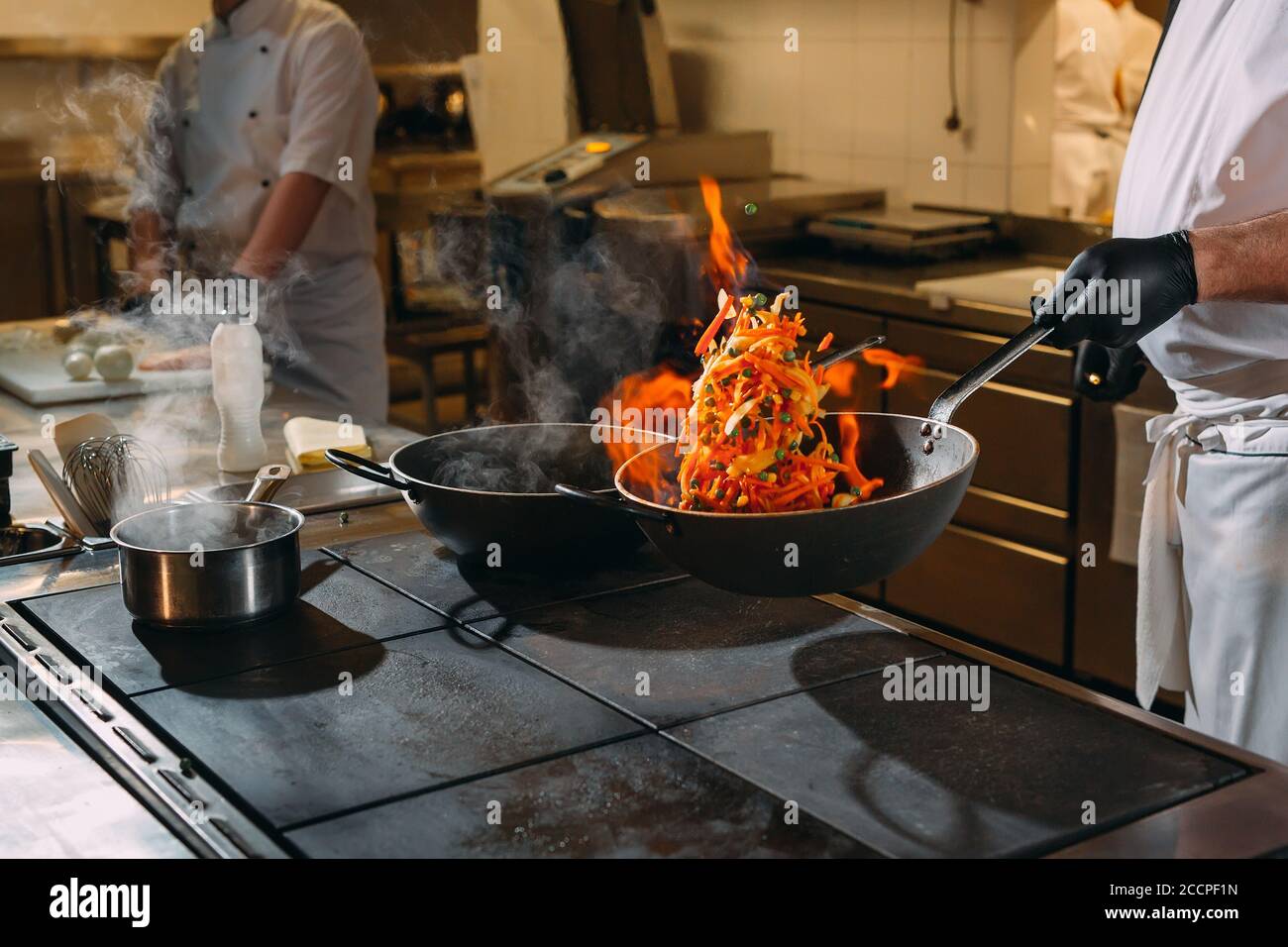 Young cooks fire hi-res stock photography and images - Alamy
