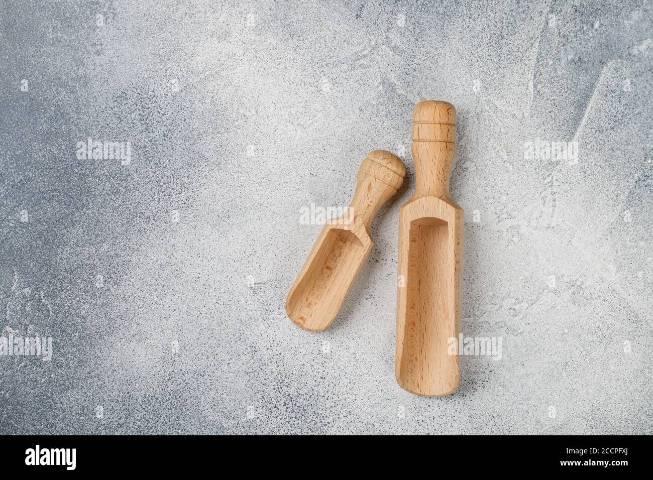 Eco friendly wooden scoops for bulk products on a grey background ...
