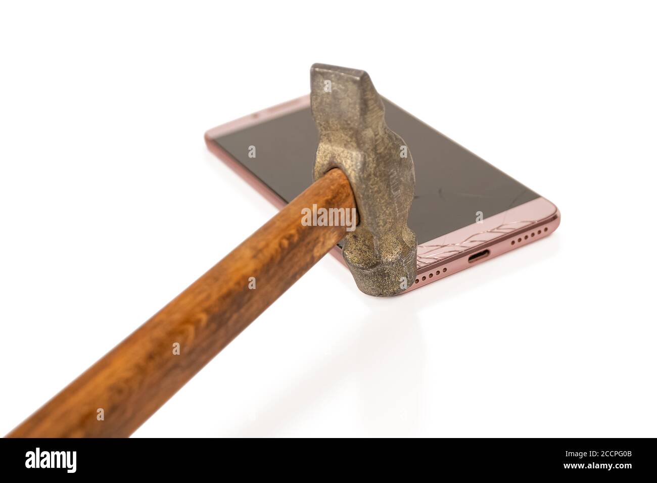 hammer smashes the phone hitting it in the corner isolated on white ...