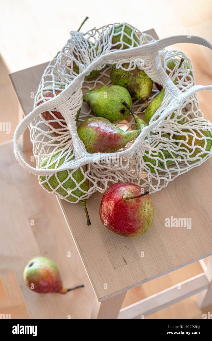 Organic pears in the reusable eco friendly string grocery bag. Shopping ...