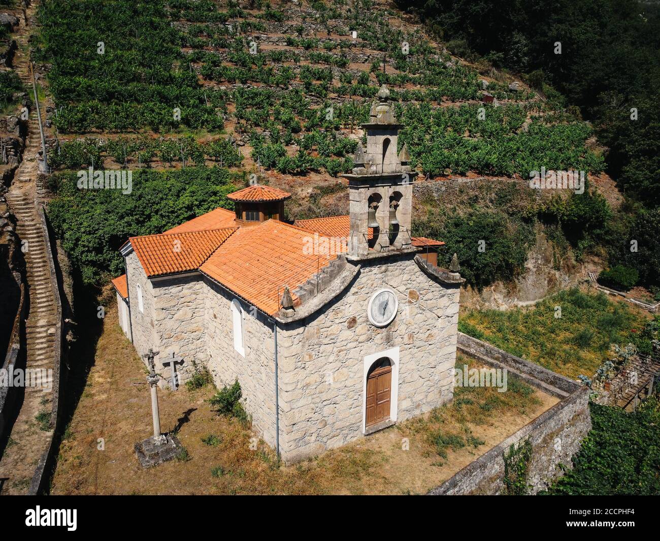 Aerial view of church in vineyard on a hill. Belesar in Ribeira Sacra ...