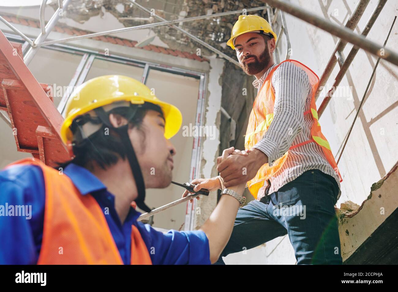 Business stairs helping people hi-res stock photography and images - Alamy