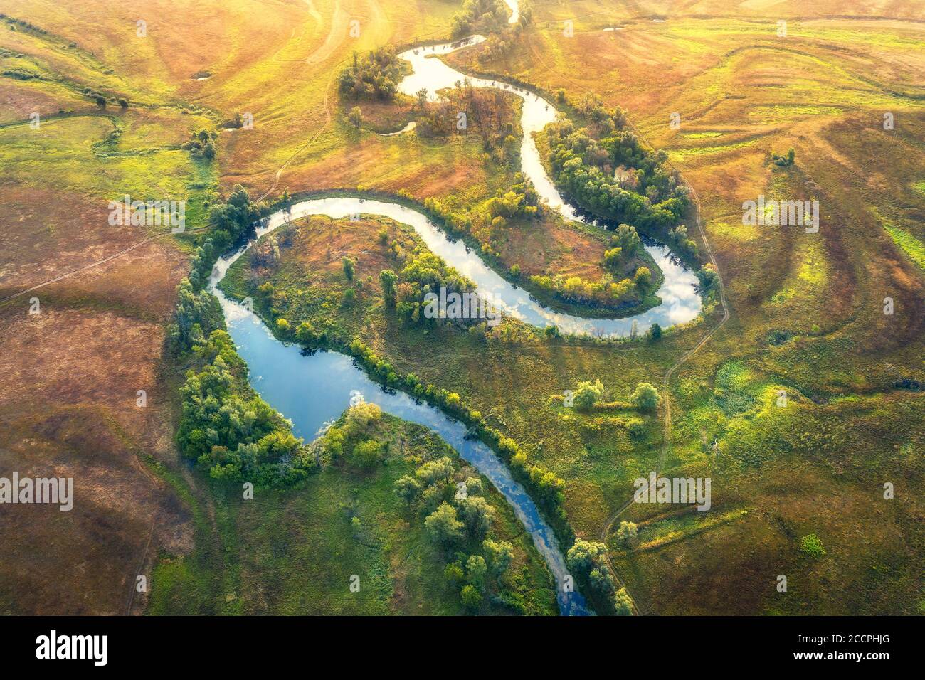 Aerial view of beautiful curving river at sunrise in summer Stock Photo ...