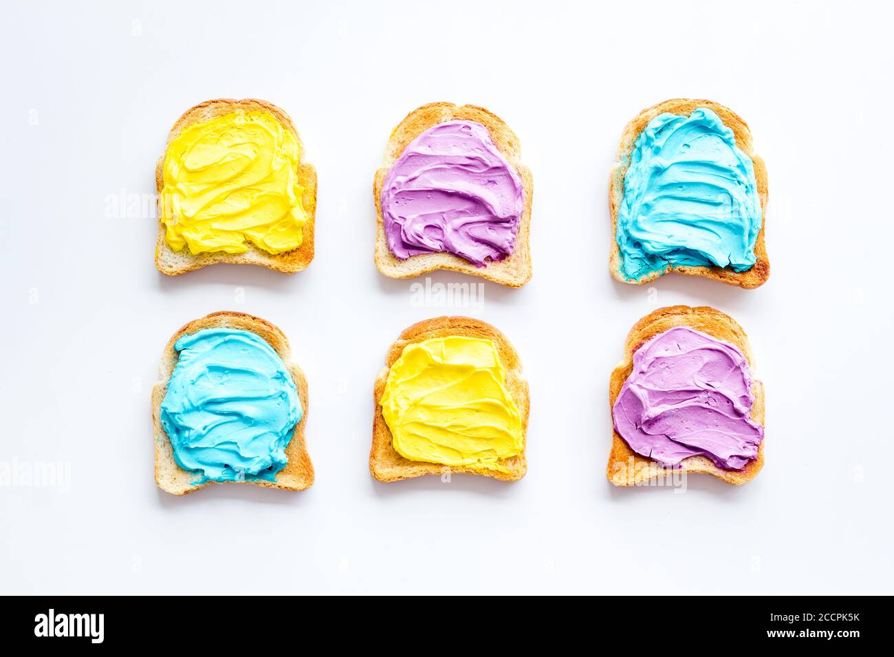 Unicorn colored toast bread slices. Food background, top view Stock ...