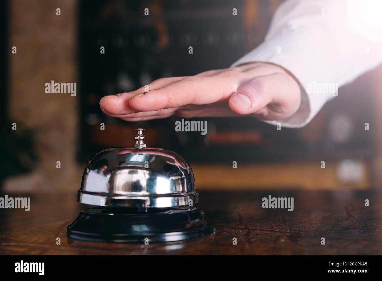 Restaurant bell vintage with hand. Hotel service bell Stock Photo - Alamy