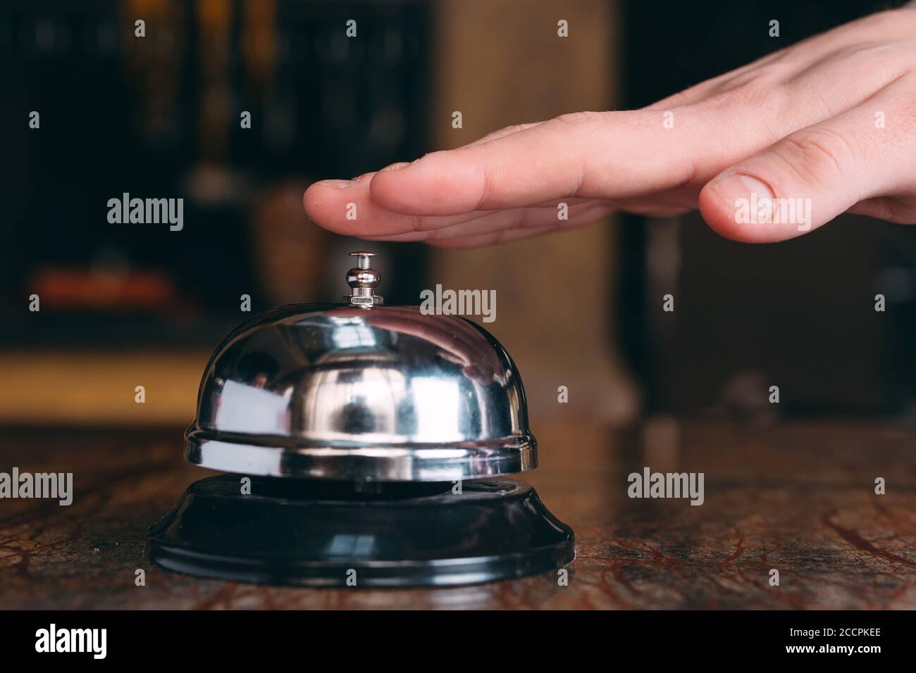 Restaurant bell vintage with hand. Hotel service bell Stock Photo - Alamy
