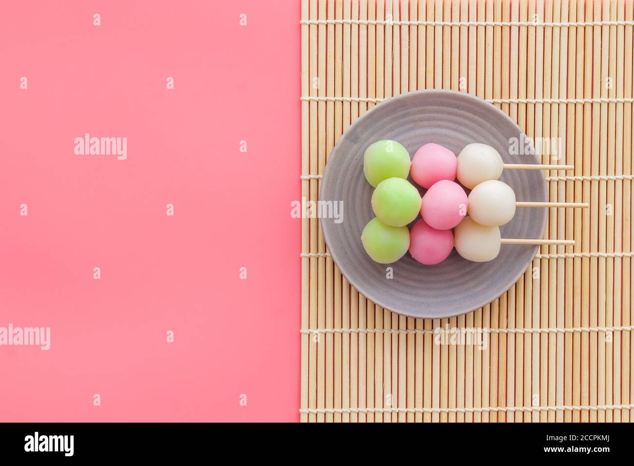 Japanese Dango dessert in pink, white and green colors, copy space ...