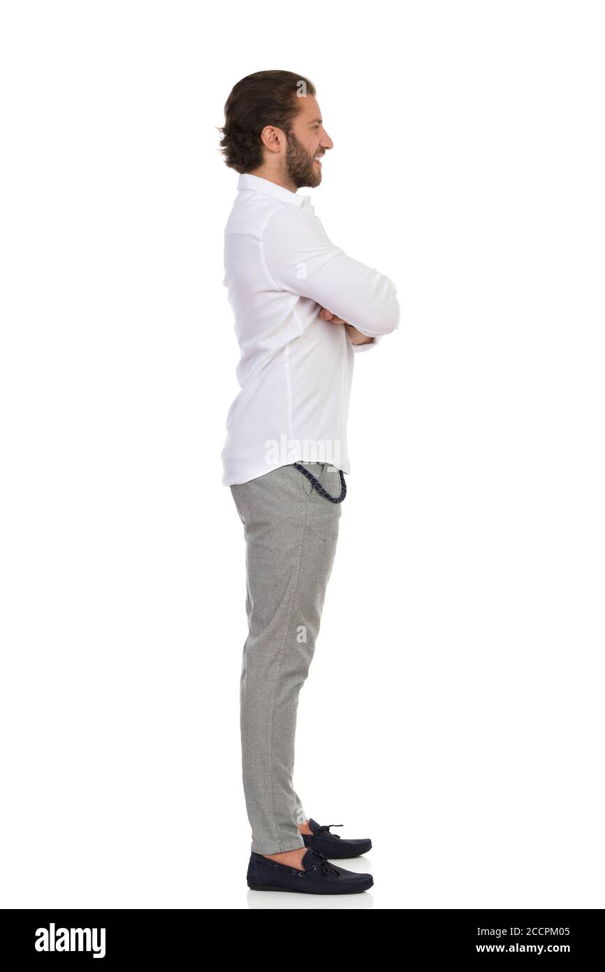 Side profile of a businessman standing with his arms crossed Stock ...