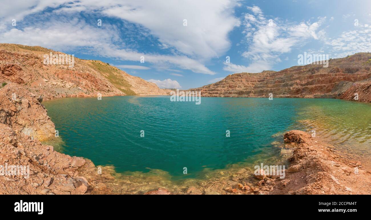 Emerald lake in a flooded quarry. Emerald green lake in flooded ...