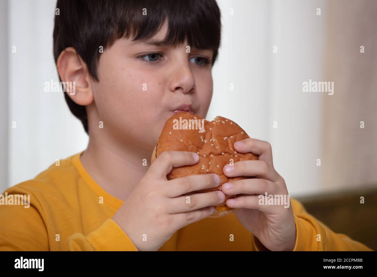 Boy eating breakfast in cafe hi-res stock photography and images - Alamy