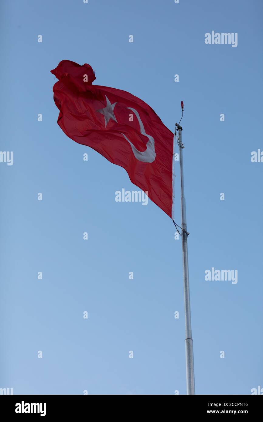 Turkish flag waving in blue sky Stock Photo - Alamy