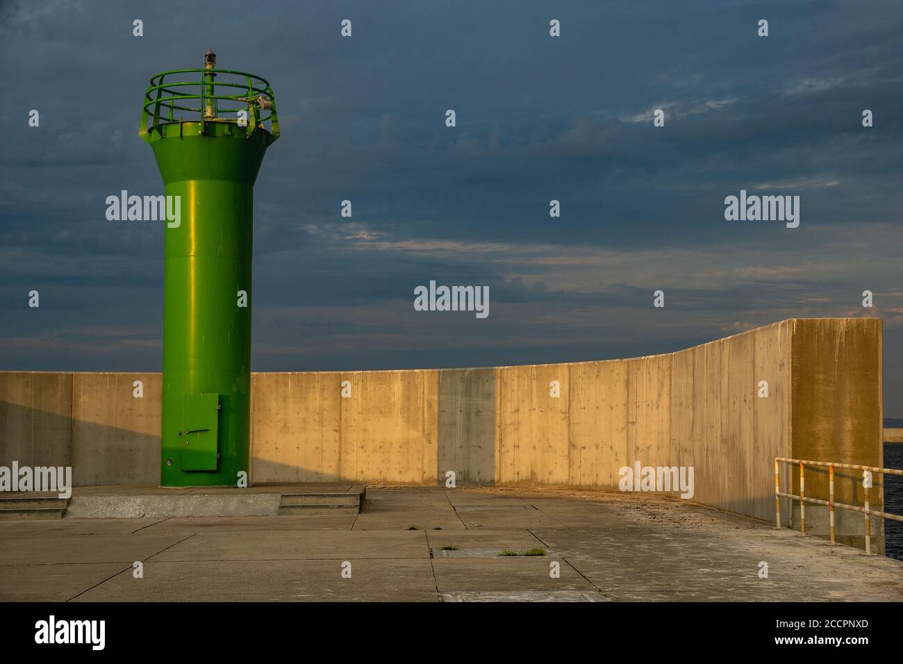 beacon in a seaport at the entrance to the port Stock Photo - Alamy