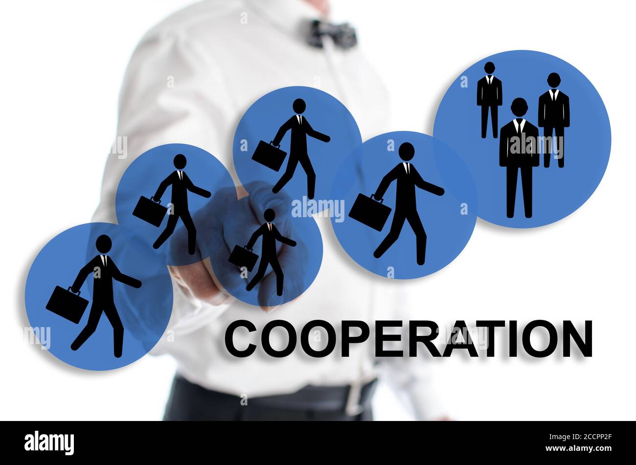 Cooperation concept shown by a man in background Stock Photo - Alamy