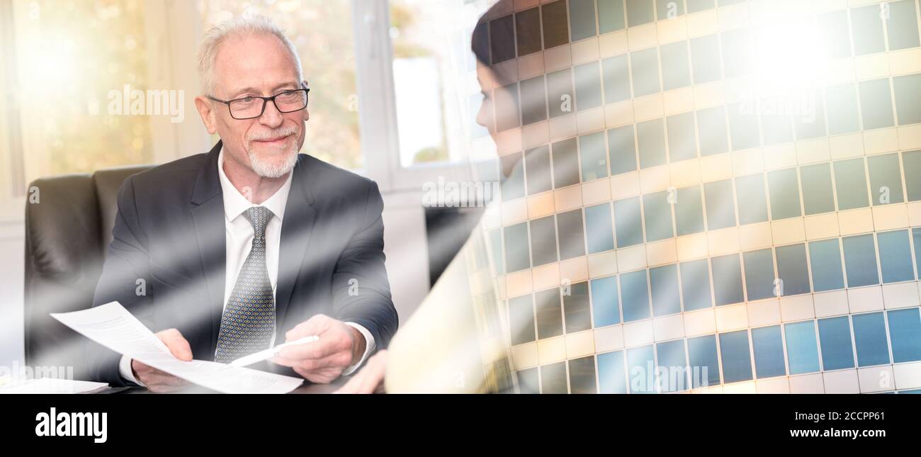 Consultant advising young woman at office, light effect; multiple ...