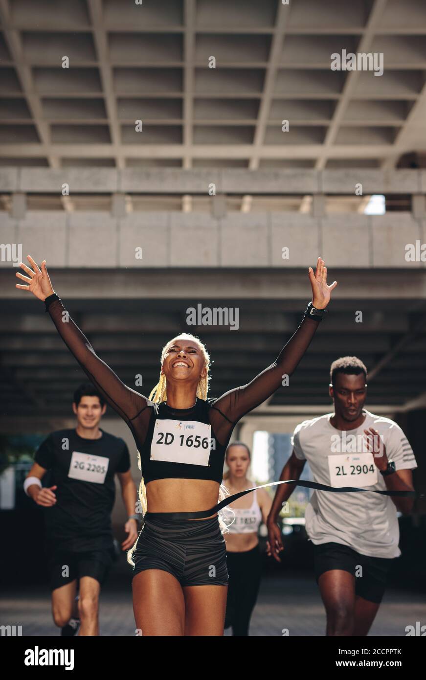 Smiling happy female runners finish female runner hi-res stock ...