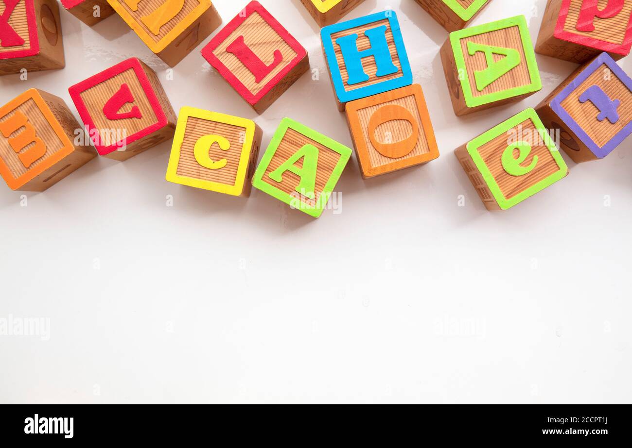 Colourful wooden ABC alphabet baby development blocks Stock Photo - Alamy