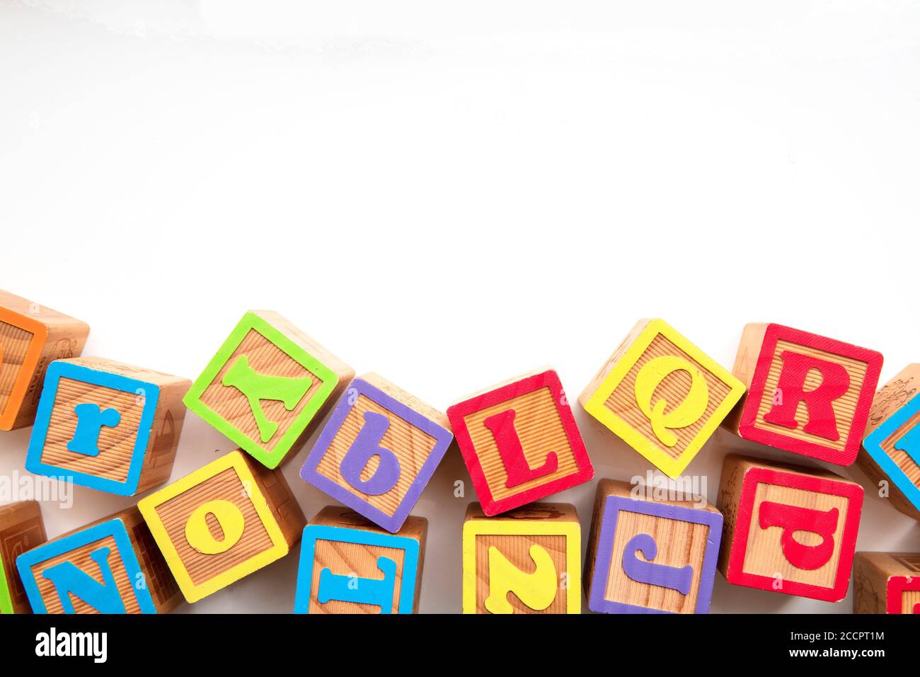 Colourful wooden ABC alphabet baby development blocks Stock Photo - Alamy