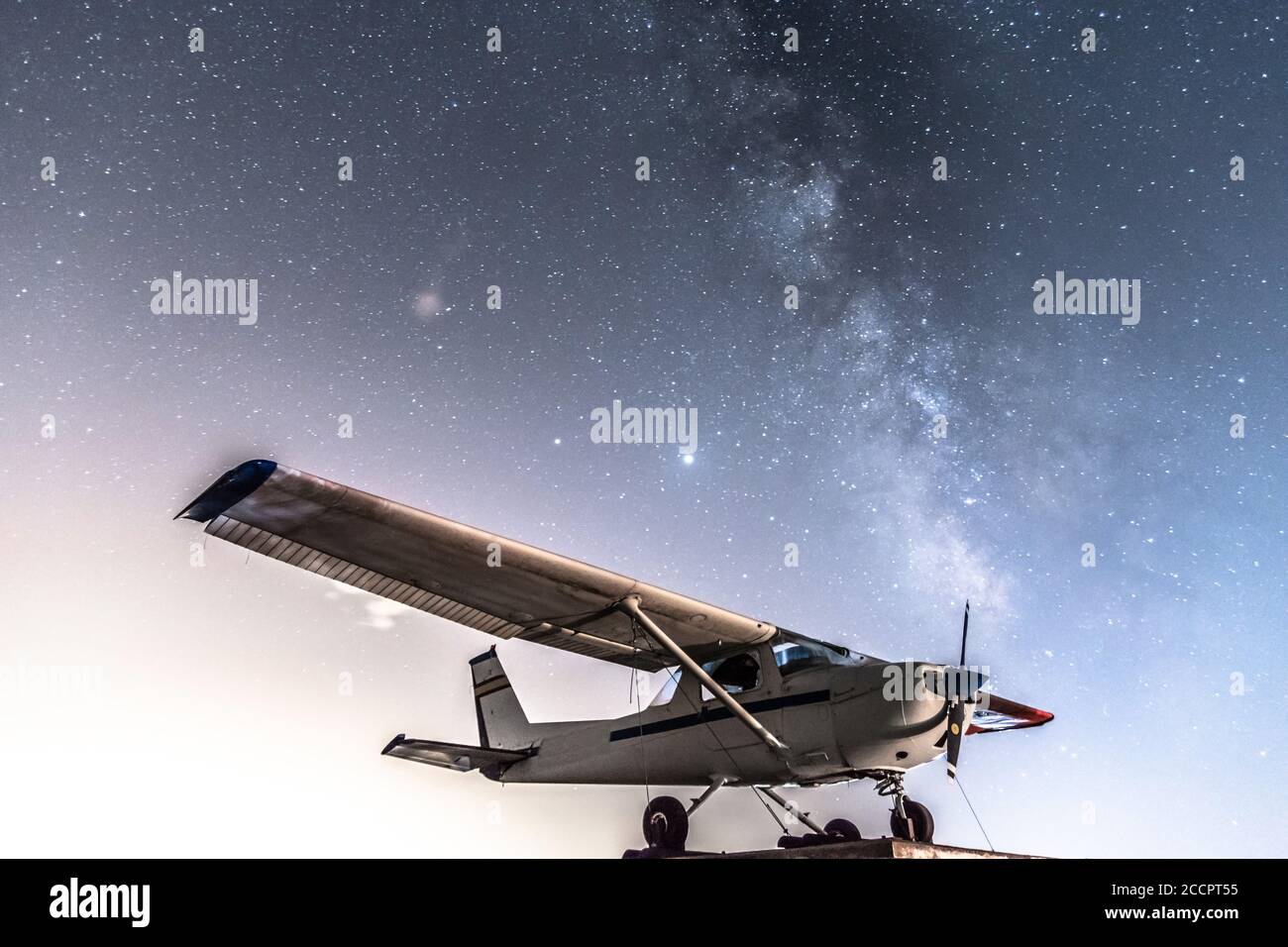 Small plane with the milky way in the background Stock Photo - Alamy