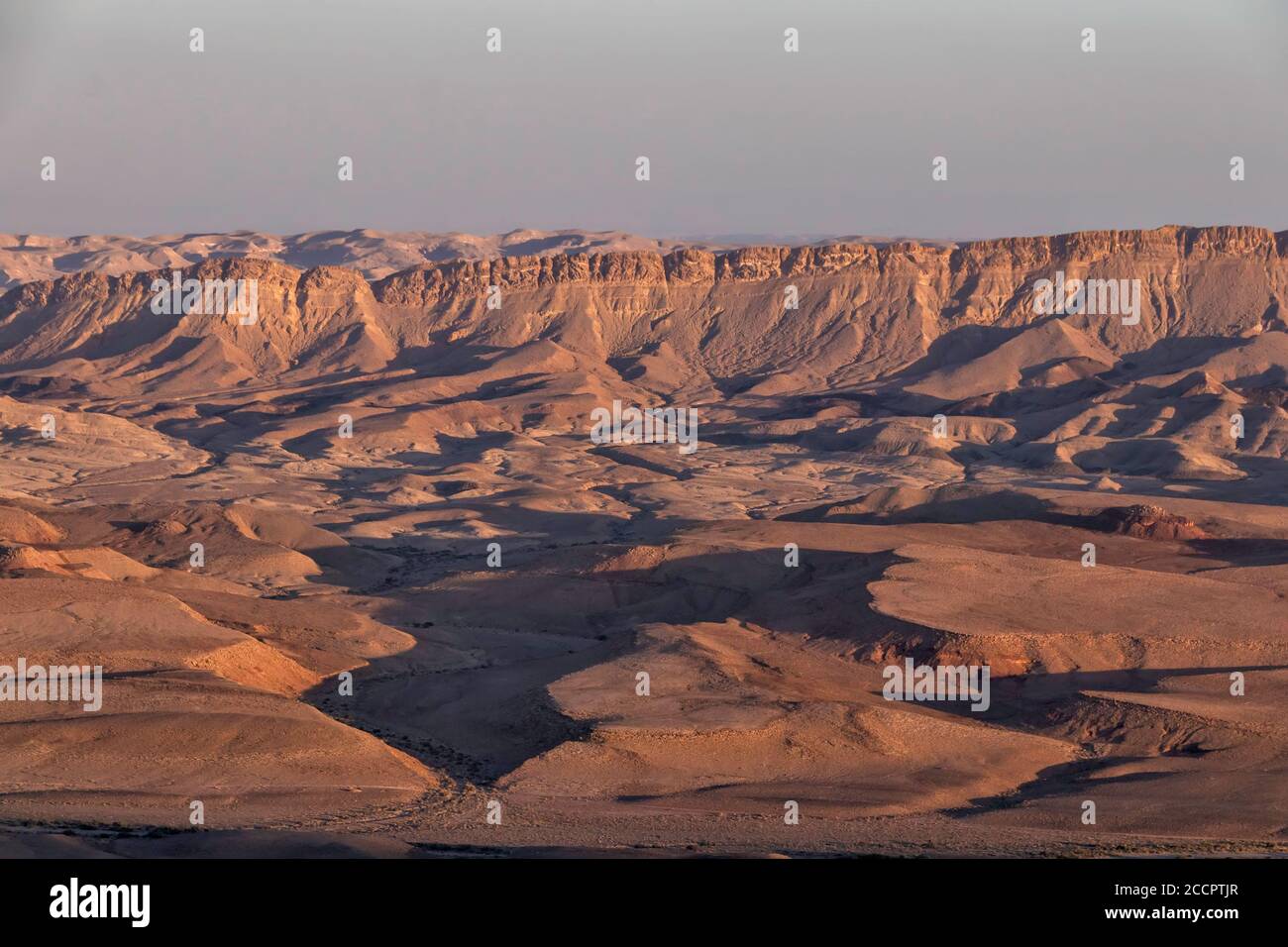 View of the mountain ranges of Ramon Crater at sunset. The Negev Desert ...