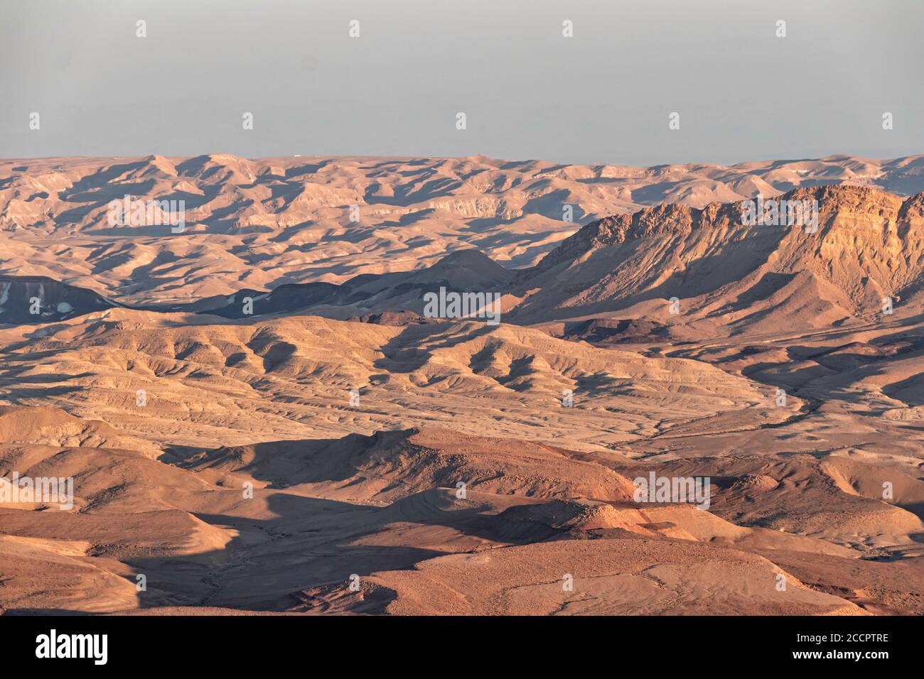 View of the mountain ranges of Ramon Crater at sunset. The Negev Desert ...