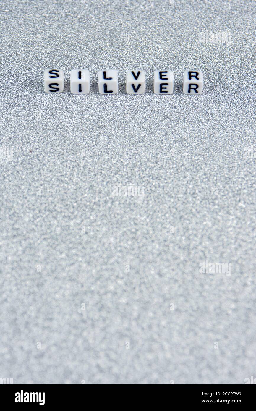 silver word formed by white dices with black letters laying in upper ...