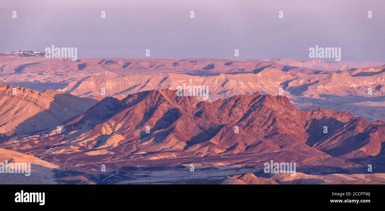 View of the mountain ranges of Ramon Crater at sunset. The Negev Desert ...