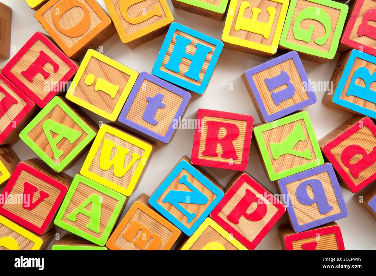 Colourful wooden ABC alphabet baby development blocks Stock Photo - Alamy