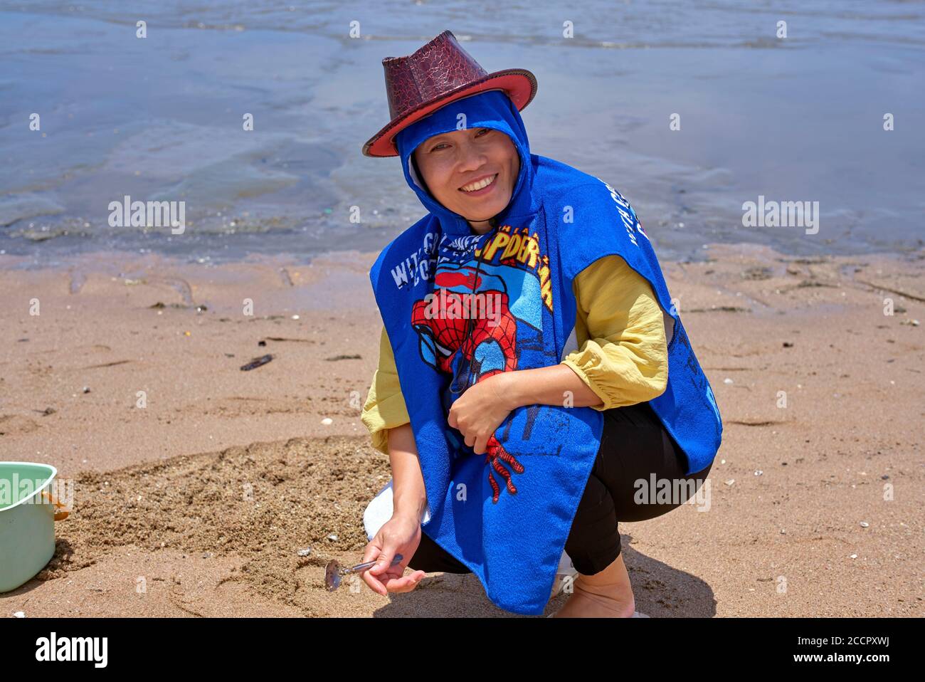 Thailand woman Portrait , happy, smiling, wearing a wool poncho throw ...