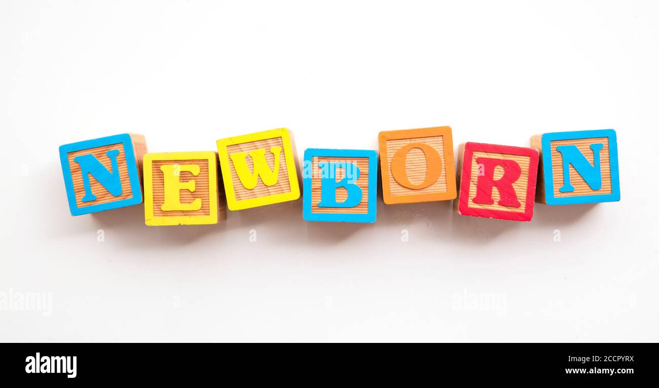 Newborn word made from colourful wooden baby development blocks Stock ...